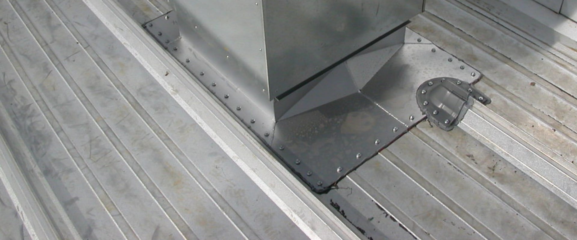 Securing Metal Panels and Flashing for Commercial Roofing